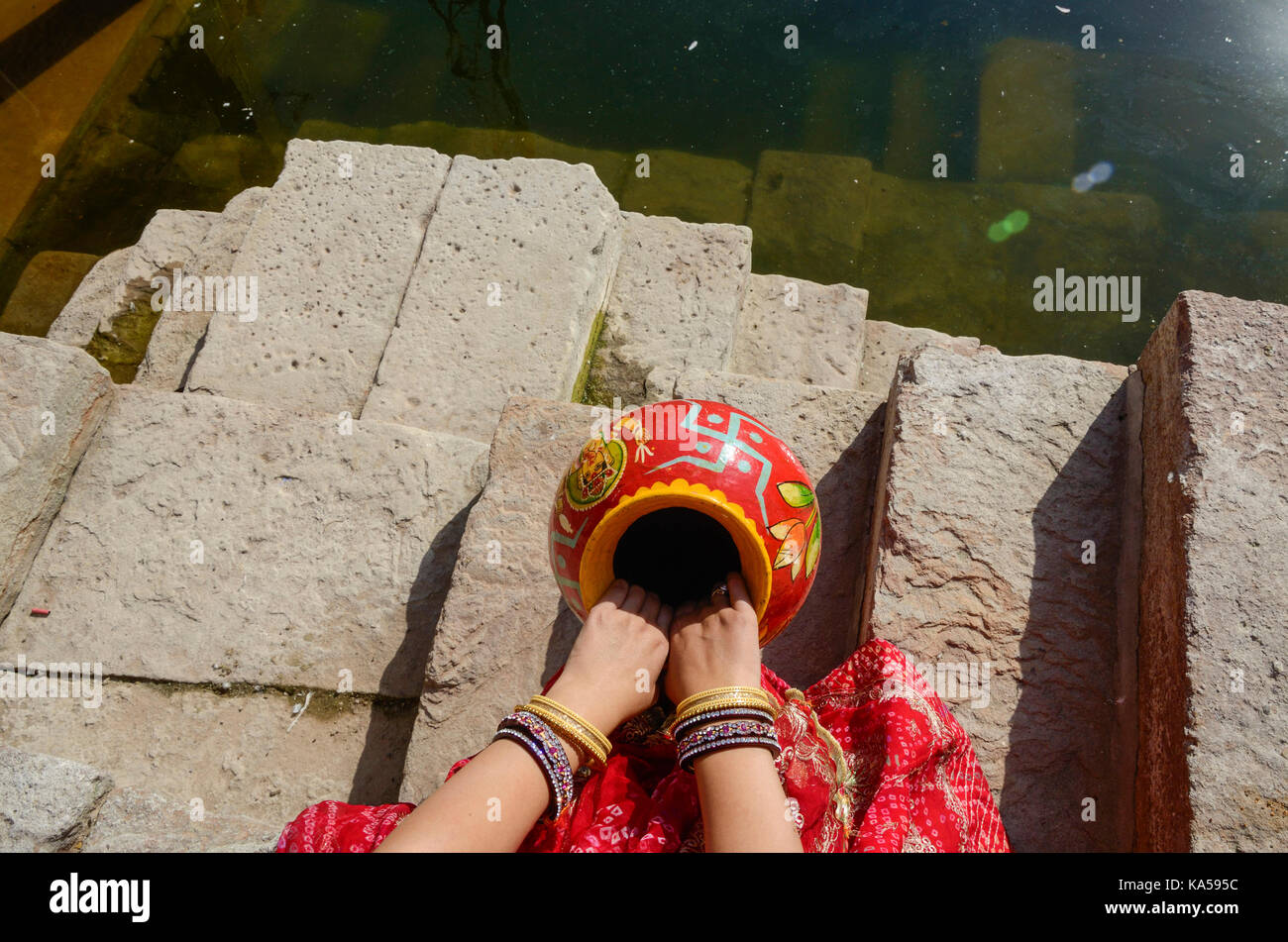 Indian woman holding water pot hi-res stock photography and images - Alamy