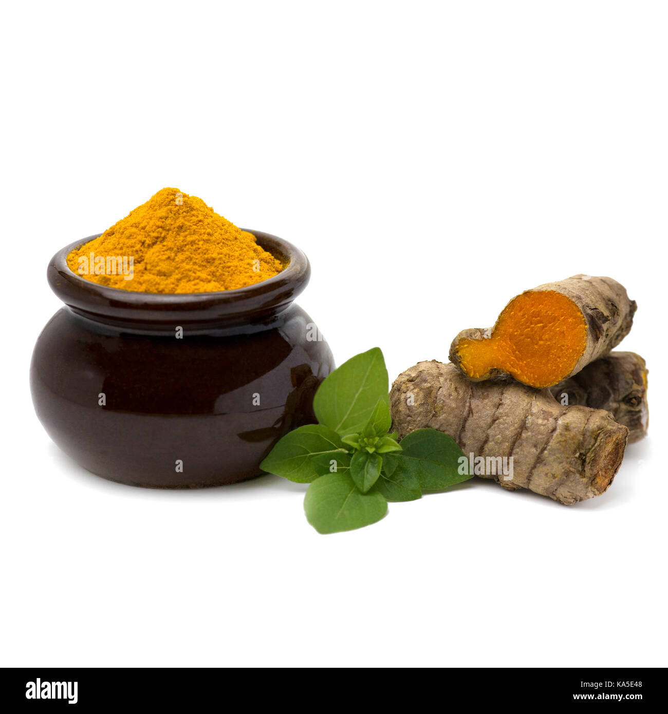 square image or turmeric in a brown pot on a white isolated background ...