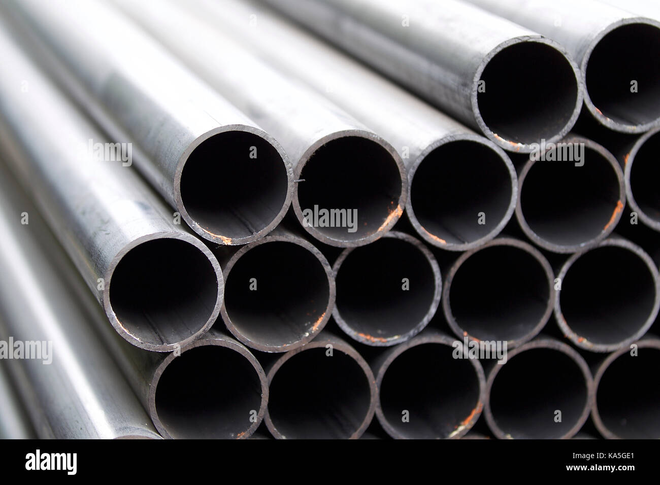 Metal profile pipe of round section in packs at the warehouse of metal ...