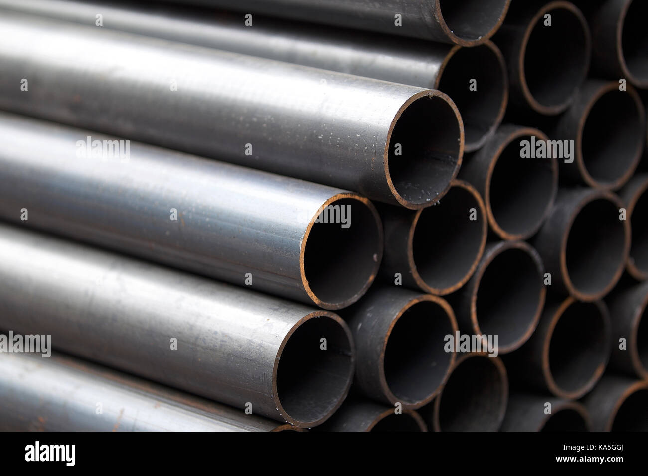 Metal profile pipe of round section in packs at the warehouse of metal ...