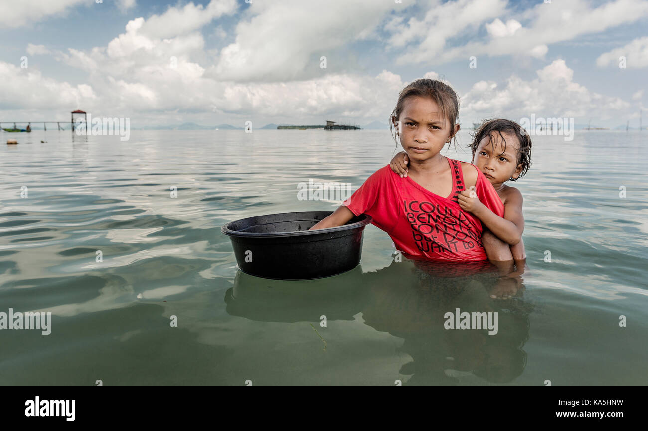 Bajau tribe kid asking for food, Semporna, Malaysia Stock Photo - Alamy