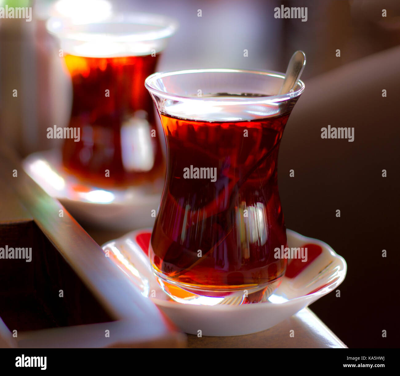 Black herbal turkish tea in the traditional glass Stock Photo - Alamy