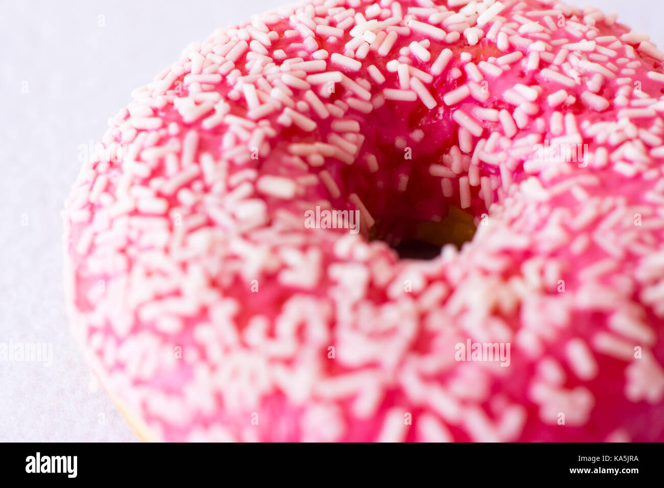 Brightly pink donut on white background. Macro. Selective focus Stock ...