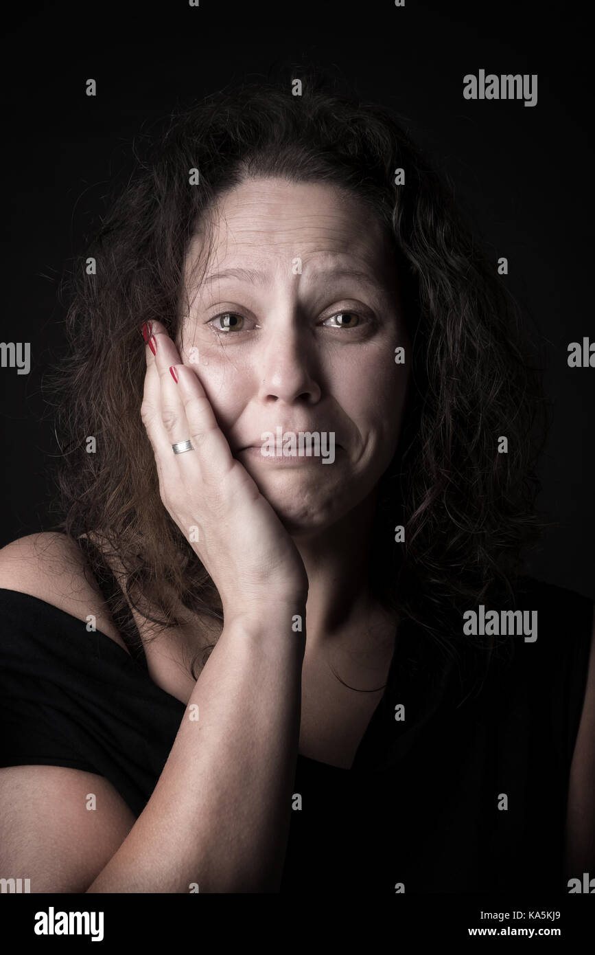 Scared woman crying, victim of domestic violence Stock Photo - Alamy