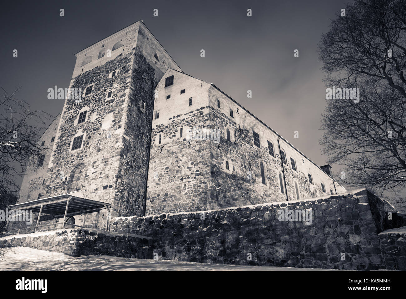 Monochrome photo of Turku Castle at night, it is a medieval building in ...