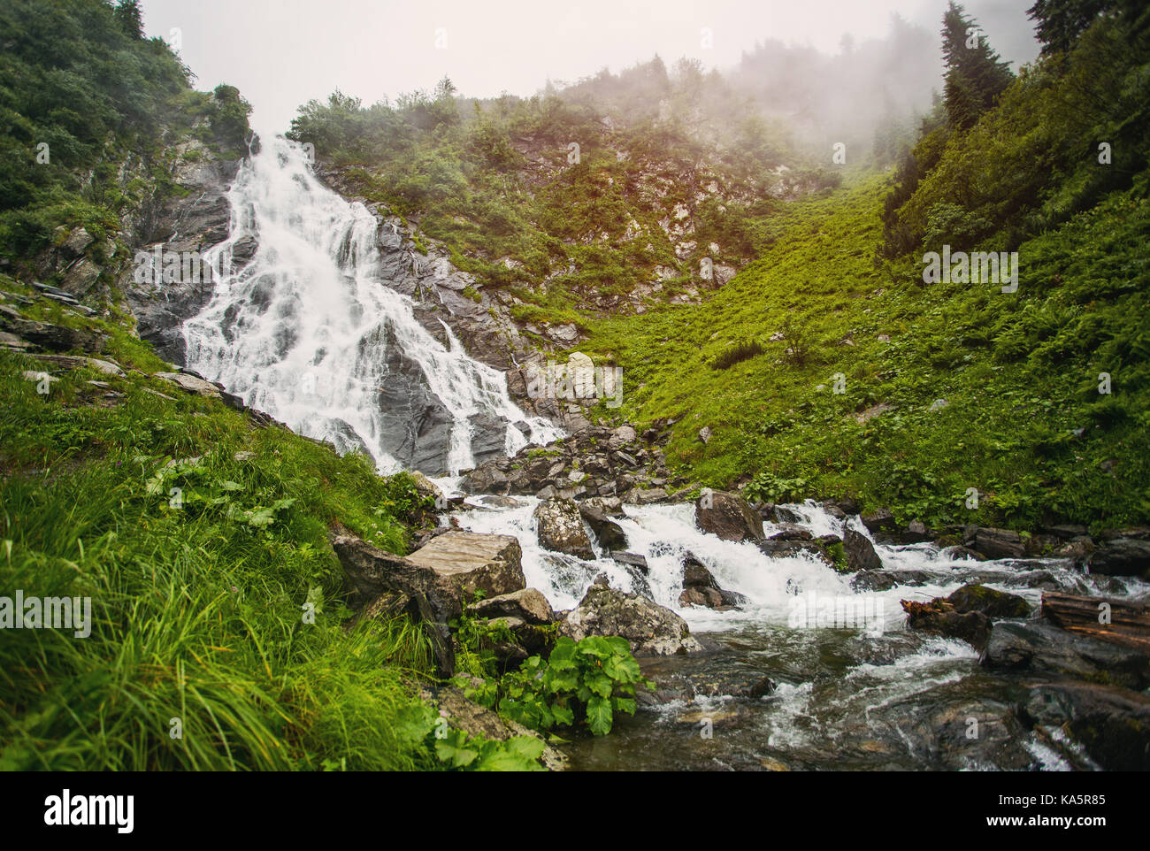 Summer landscape. Rocky waterfall in the mountains. Balea waterfall ...