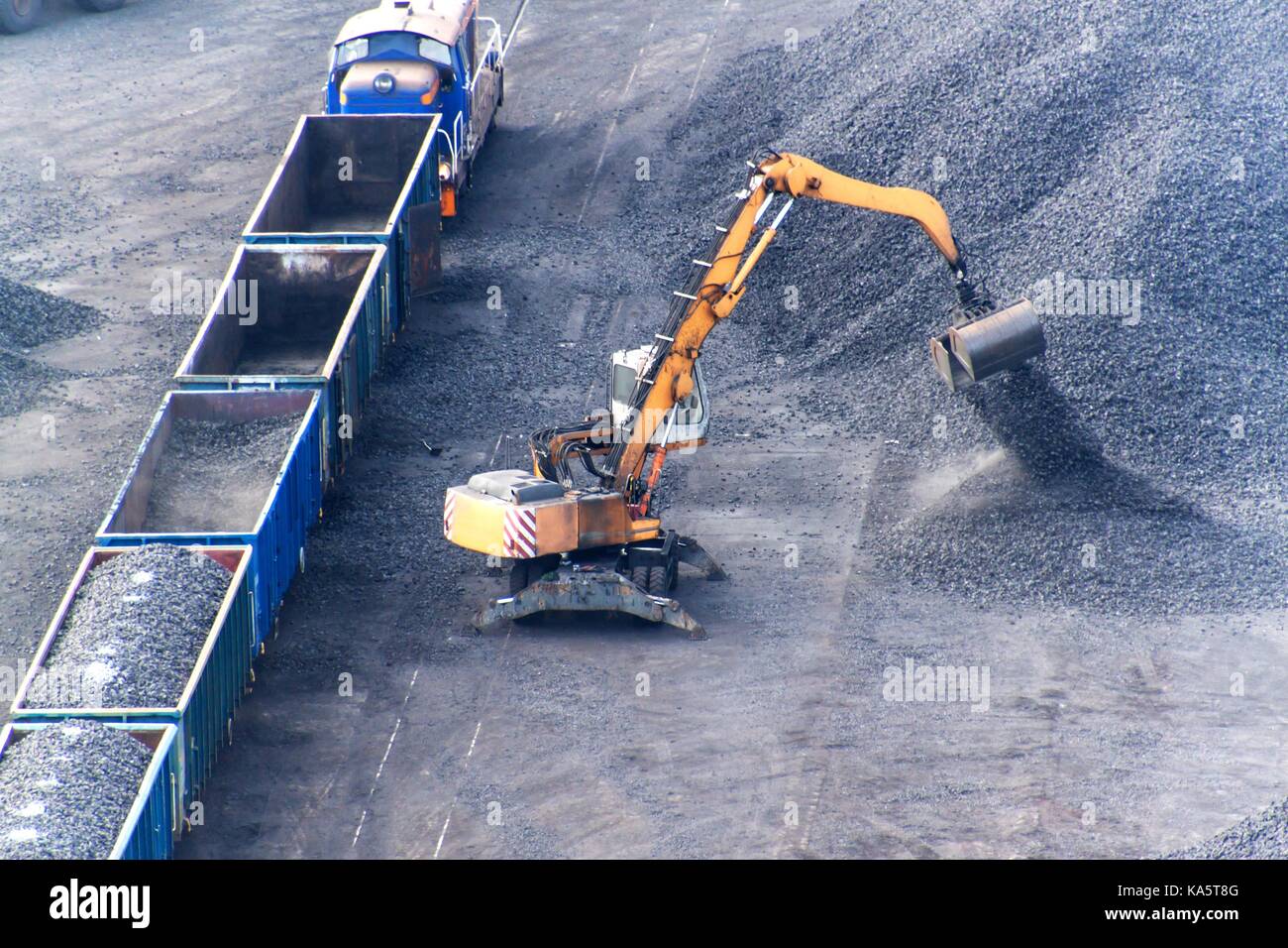Work in port coal transshipment terminal. Coal unloading of wagons with ...