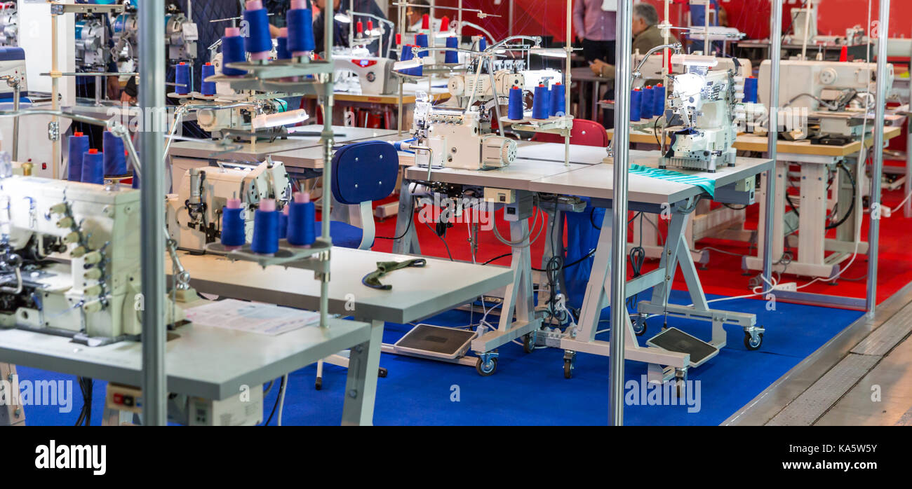 Sewing factory, nobody, overlock, stitching machines. Clothing sew ...