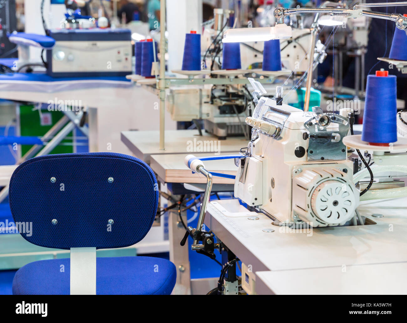 Sewing machine, nobody, clothing sew on fabric. Factory production ...