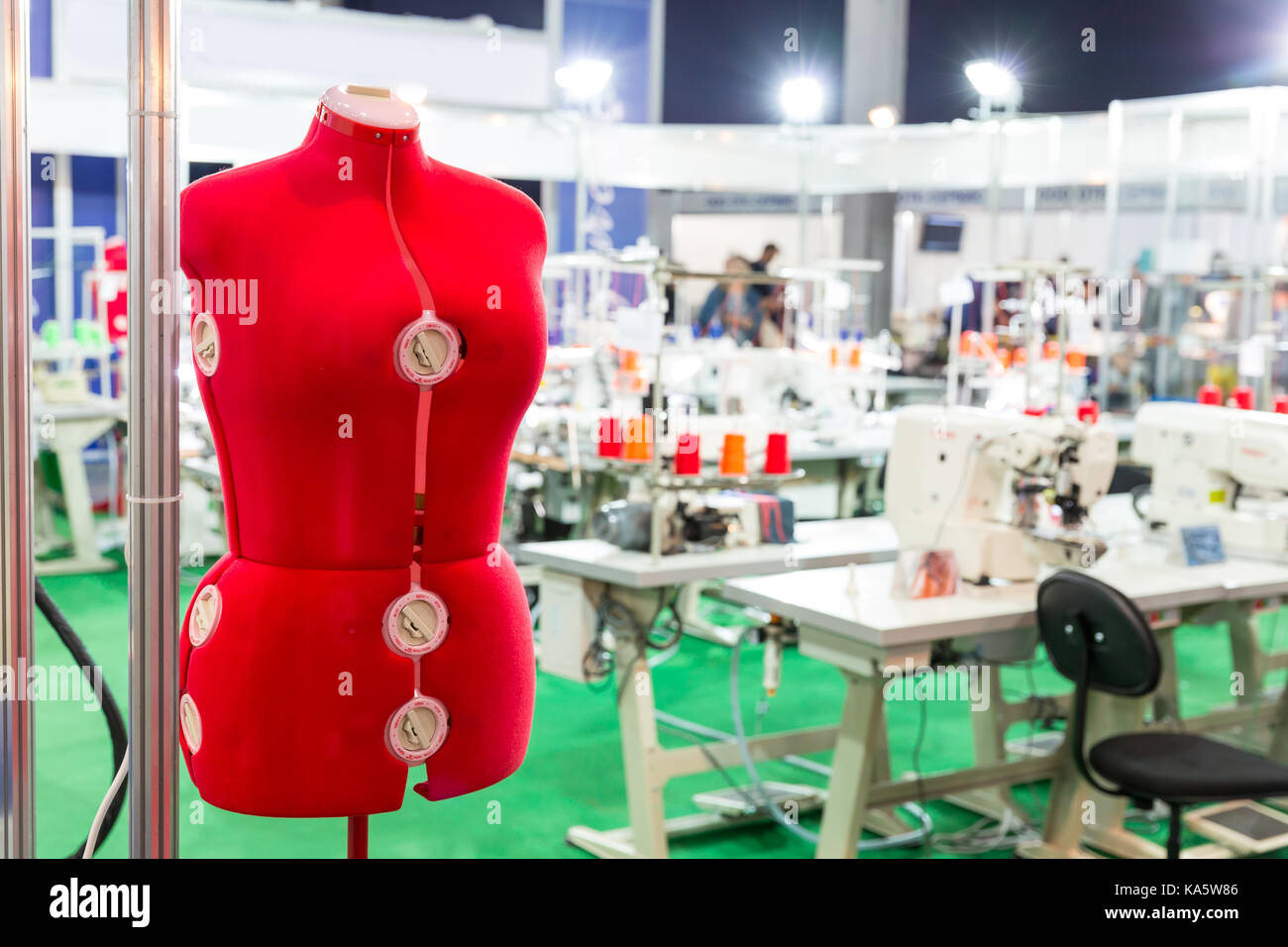 Dummy for clothes on sewing factory, nobody. Overlock machines ...