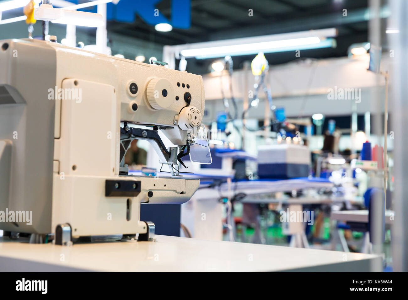 Sewing machine and cloth in cutting shop, nobody, clothing factory ...