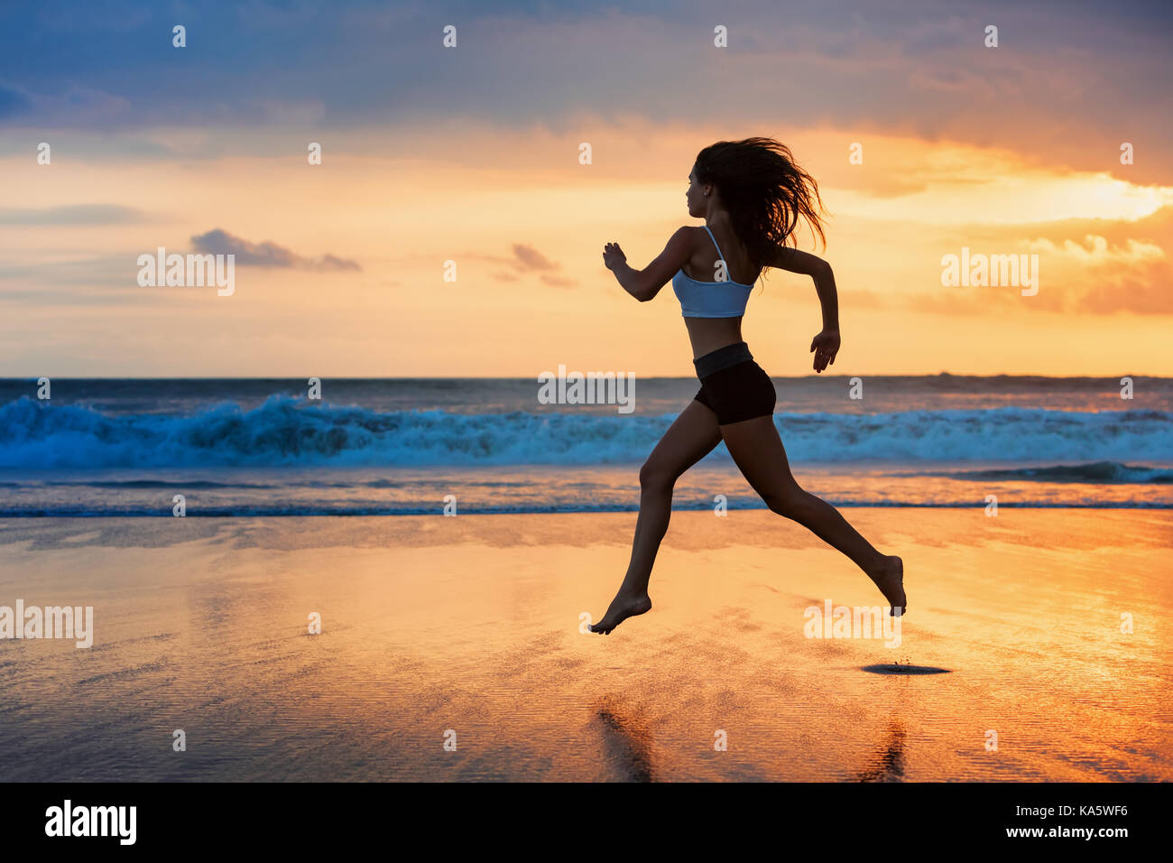 Teenager woman running beach hi-res stock photography and images - Alamy