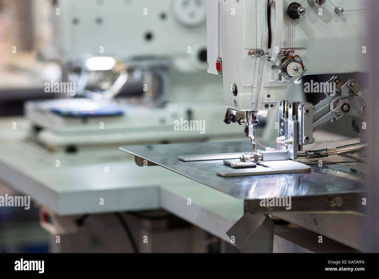 Sewing machine closeup, nobody, dressmaker equipment, cloth industry ...