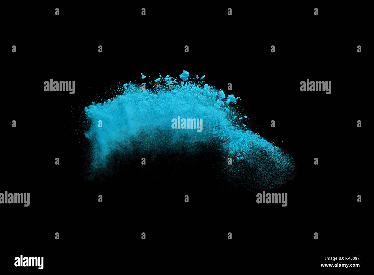 Powder explosion. Closeup of blue dust particle explosion isolated on ...