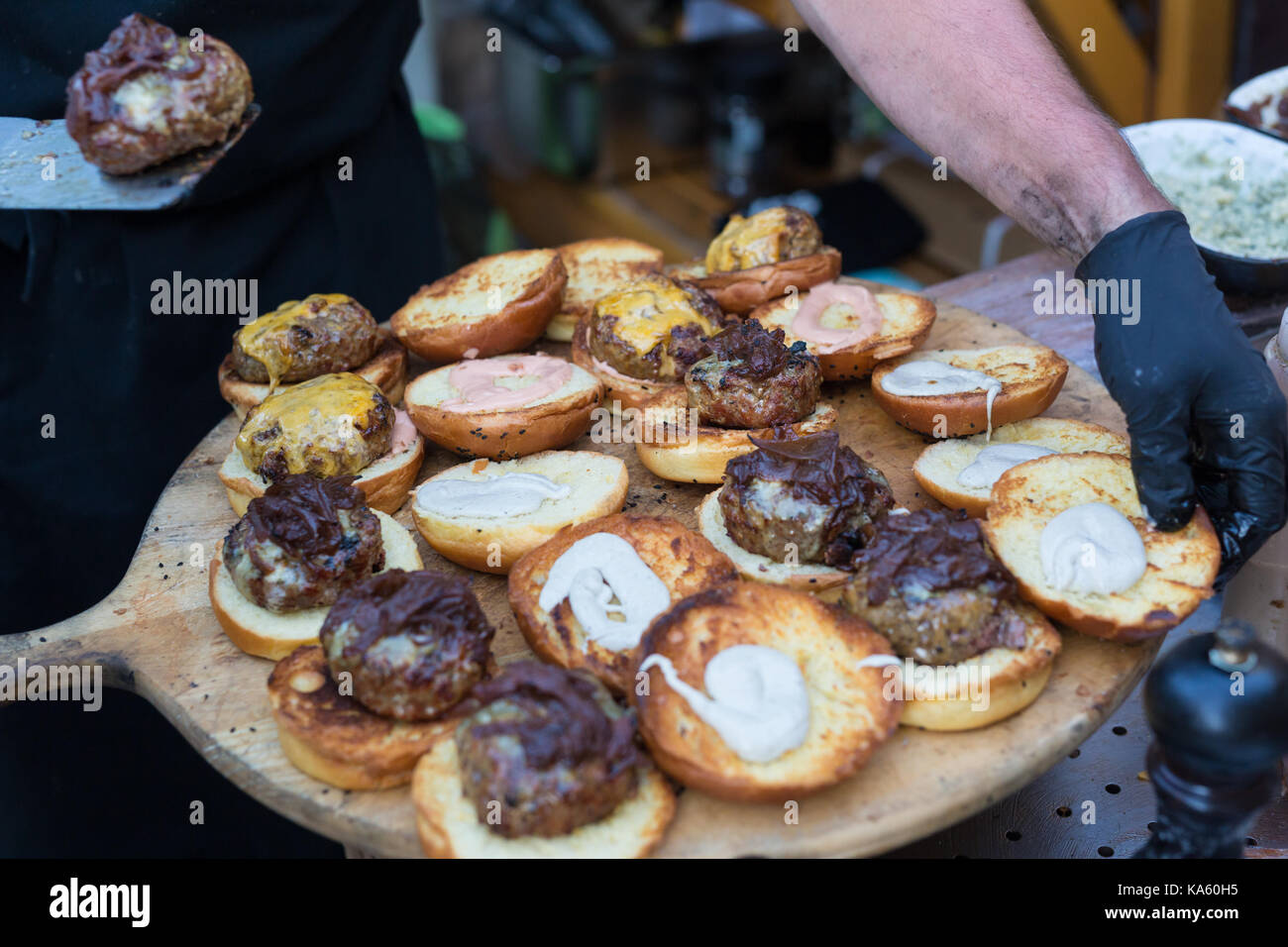 Chef making beef burgers outdoor on open kitchen international food ...