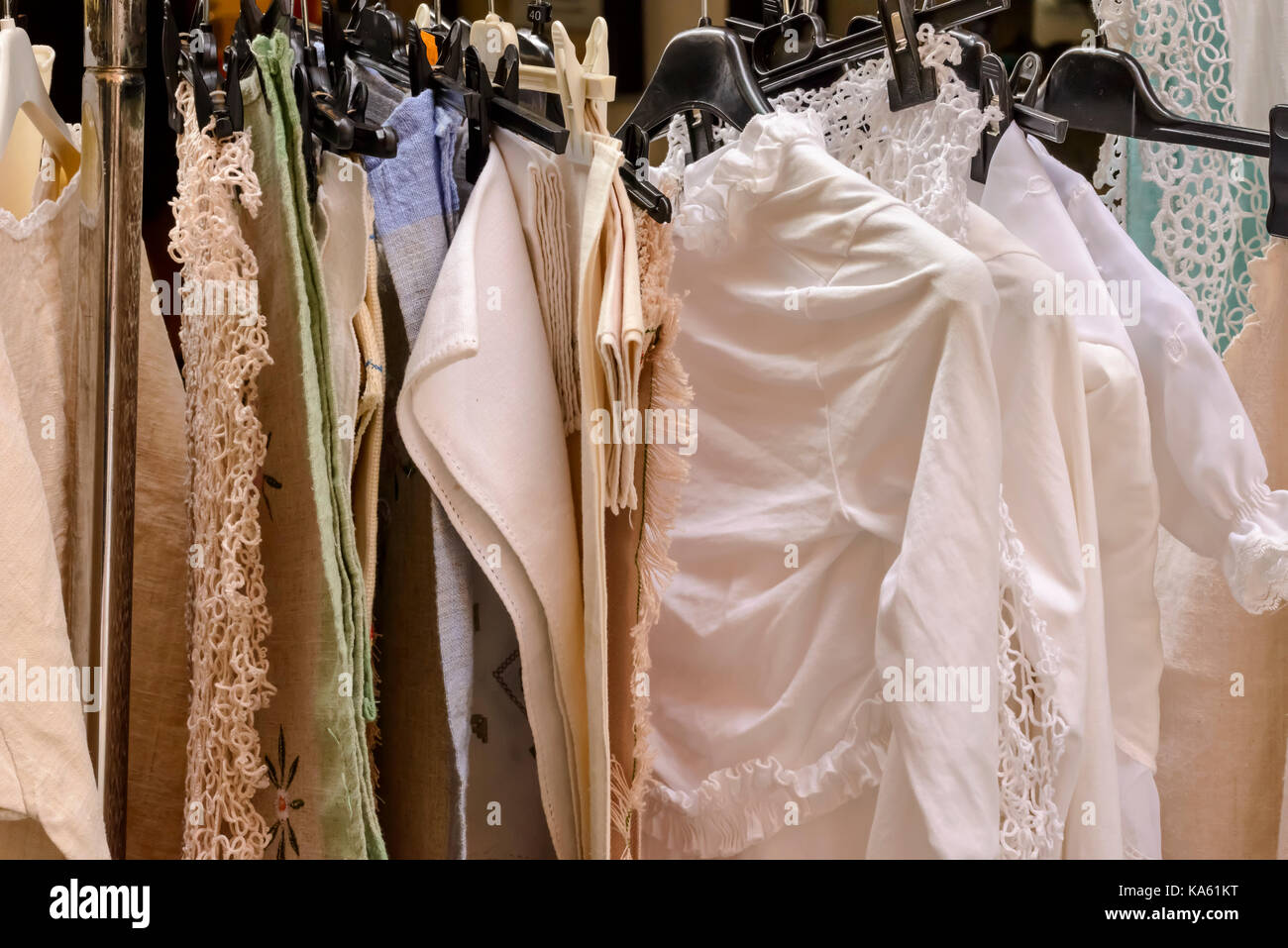 cluster of vintage clothes on sale in bric-a-brac antiques street ...