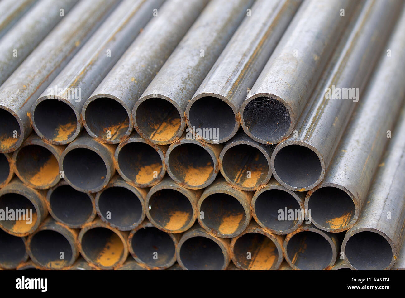 Metal profile pipe of round section in packs at the warehouse of metal ...