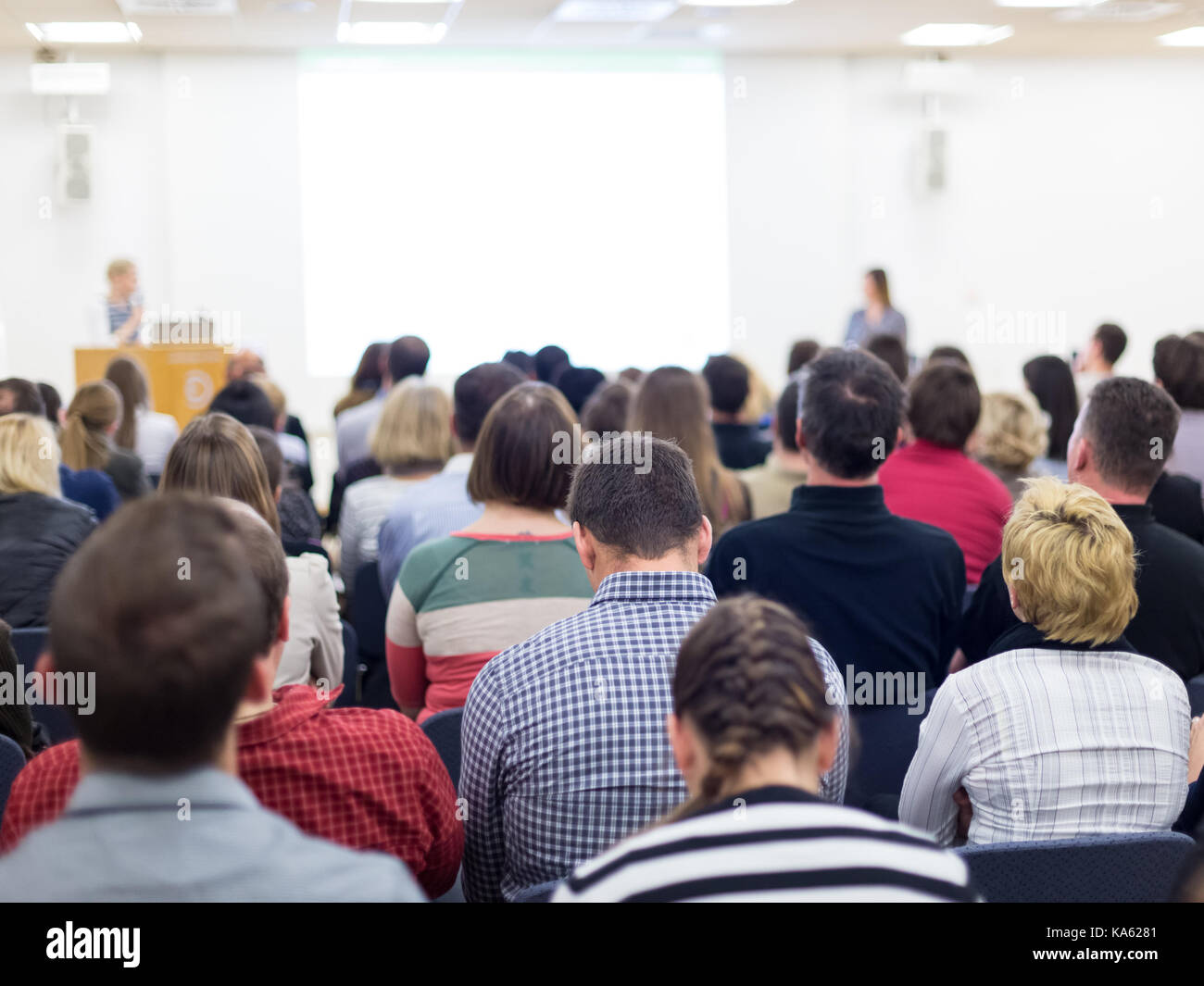 Woman giving presentation on business conference Stock Photo - Alamy