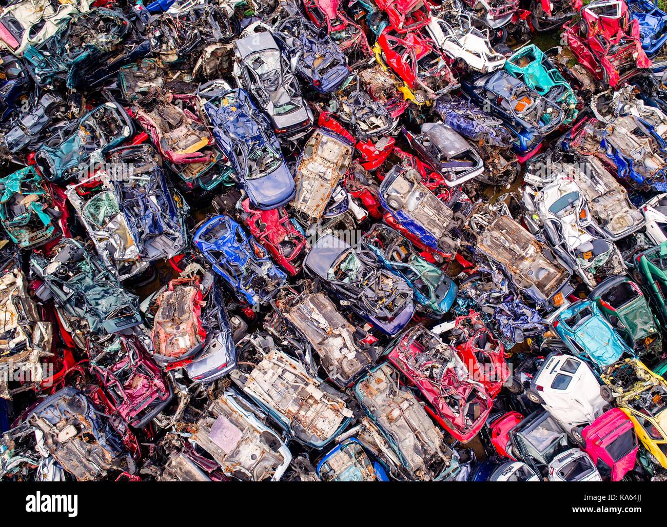 Destroyed scrapped cars stacked on a scrap yard. Car recycling Stock ...