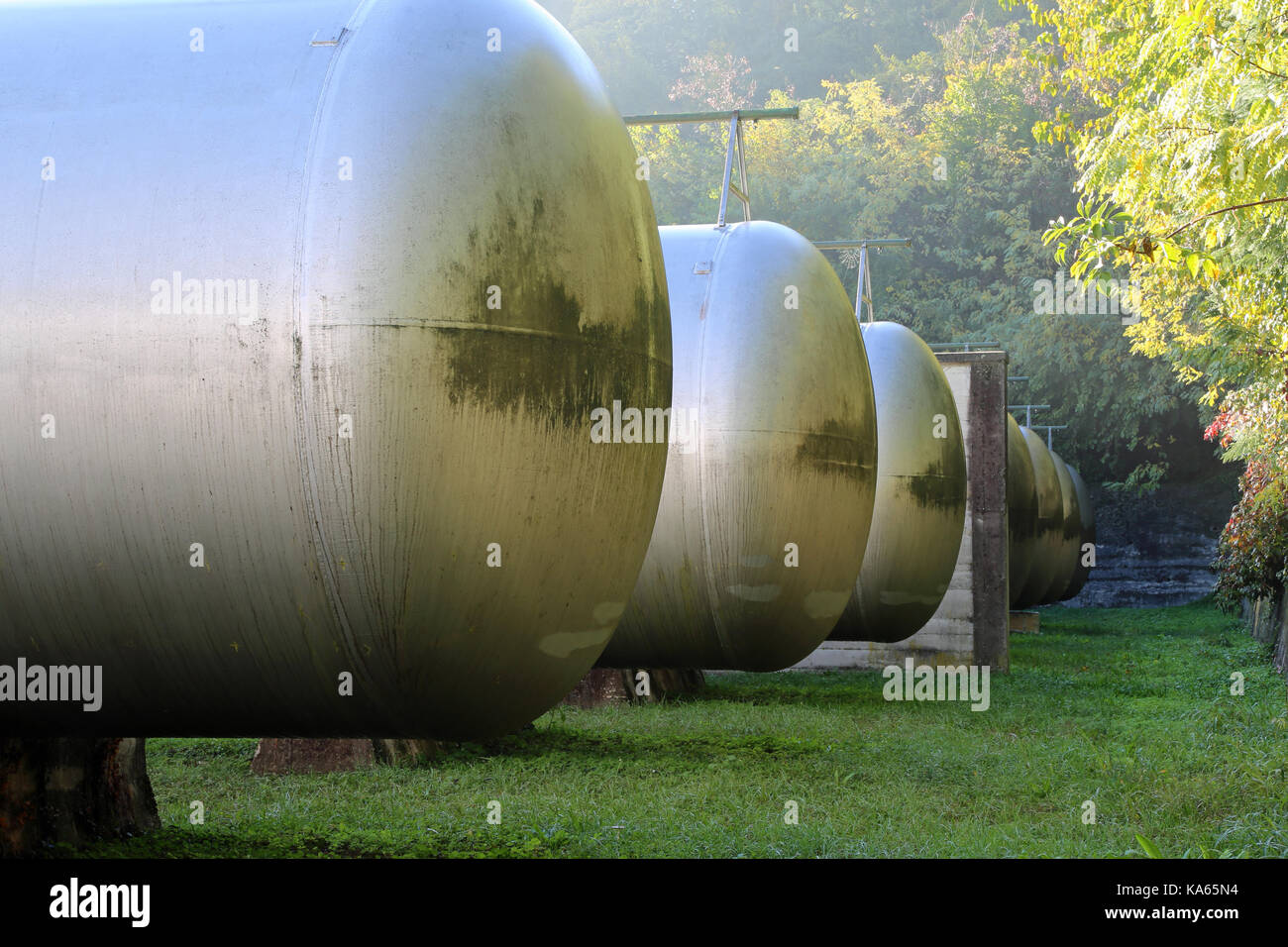 many huge tanks for the storage of methane gas in an industrial zone ...
