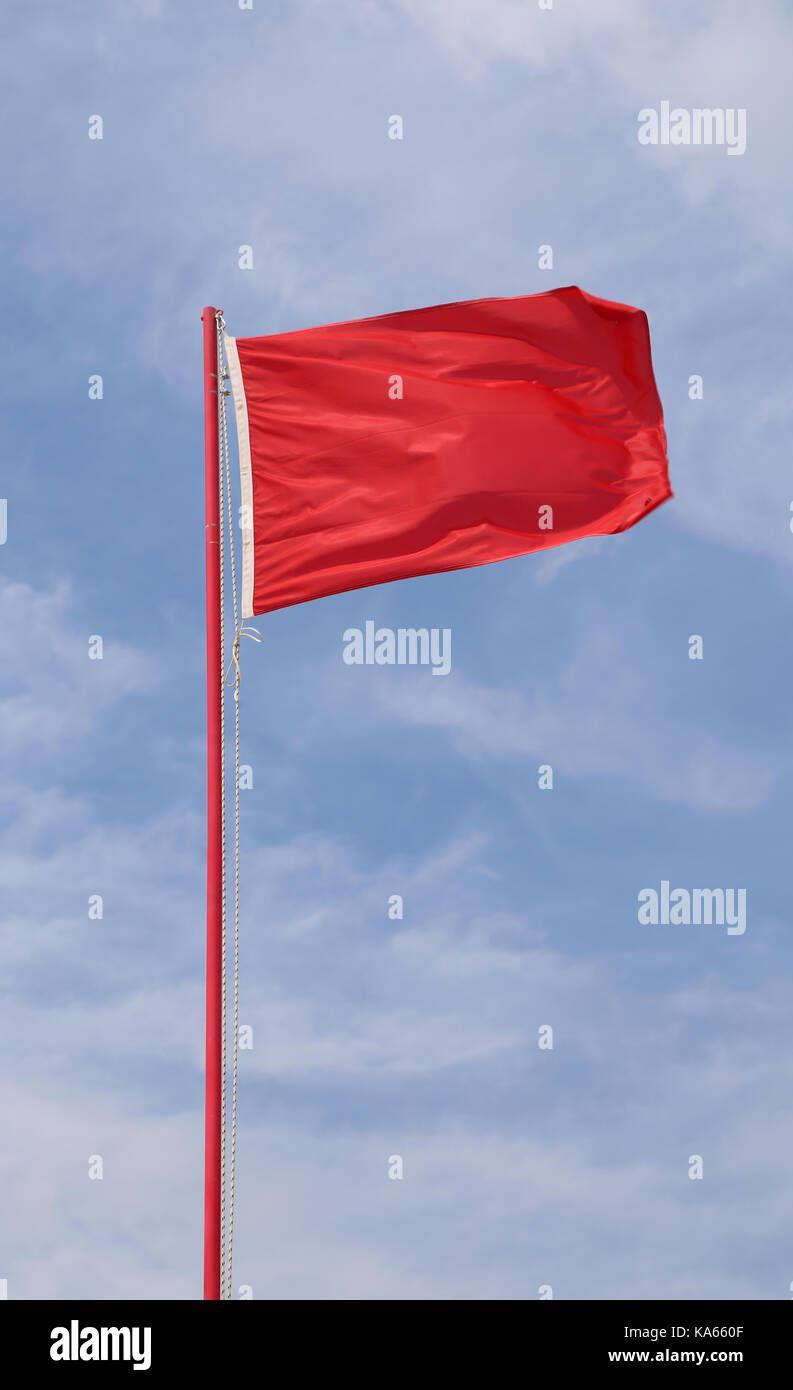 flying waving flag indicating a state of danger and alarm with ...
