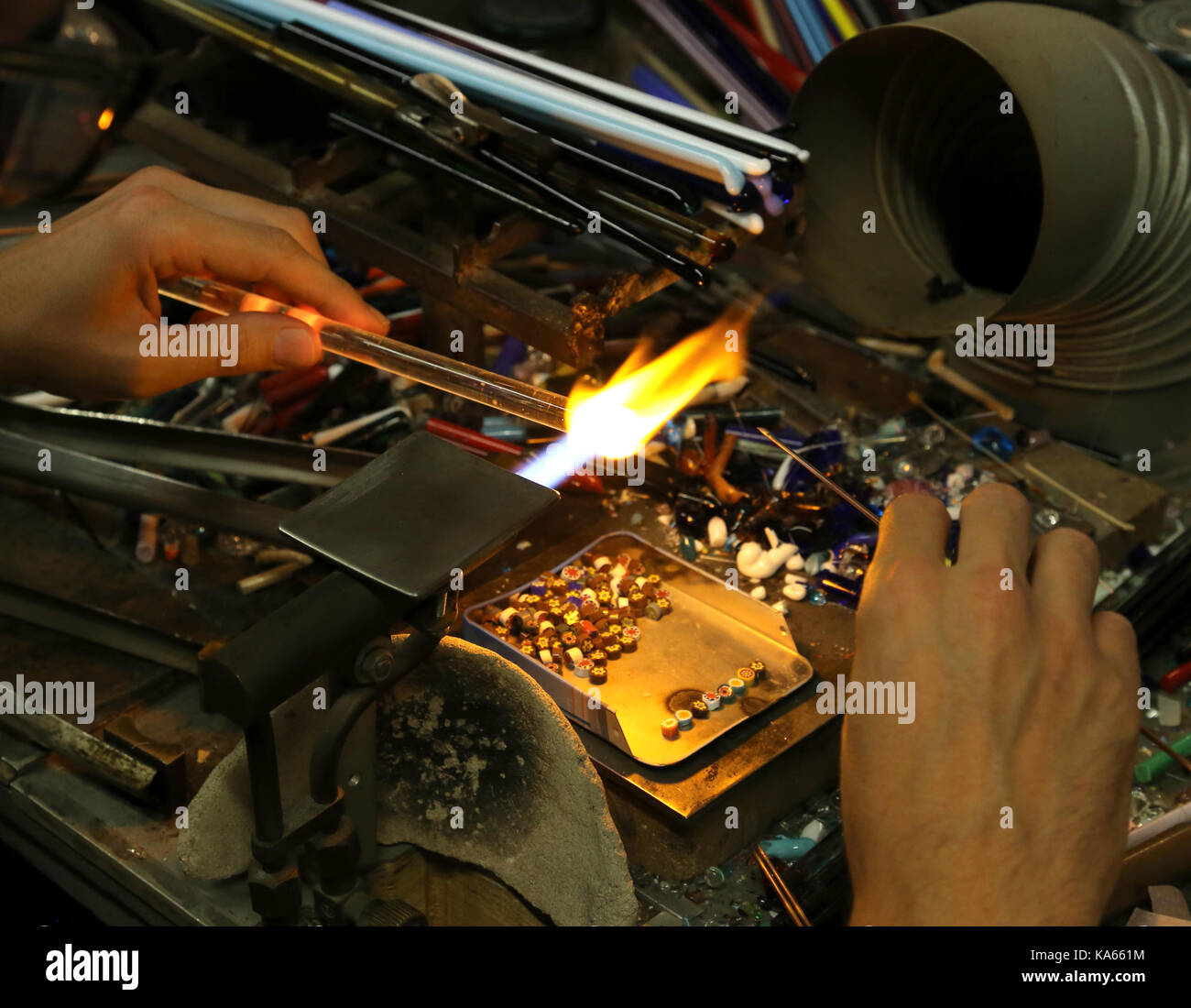 glazier while shaping the glass with a very high temperature flame in ...
