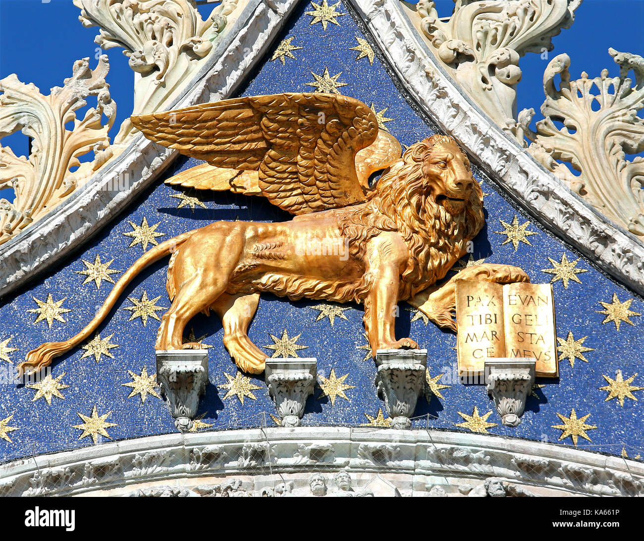 Statue golden winged lion on the Basilica of St. Mark in Venice in ...