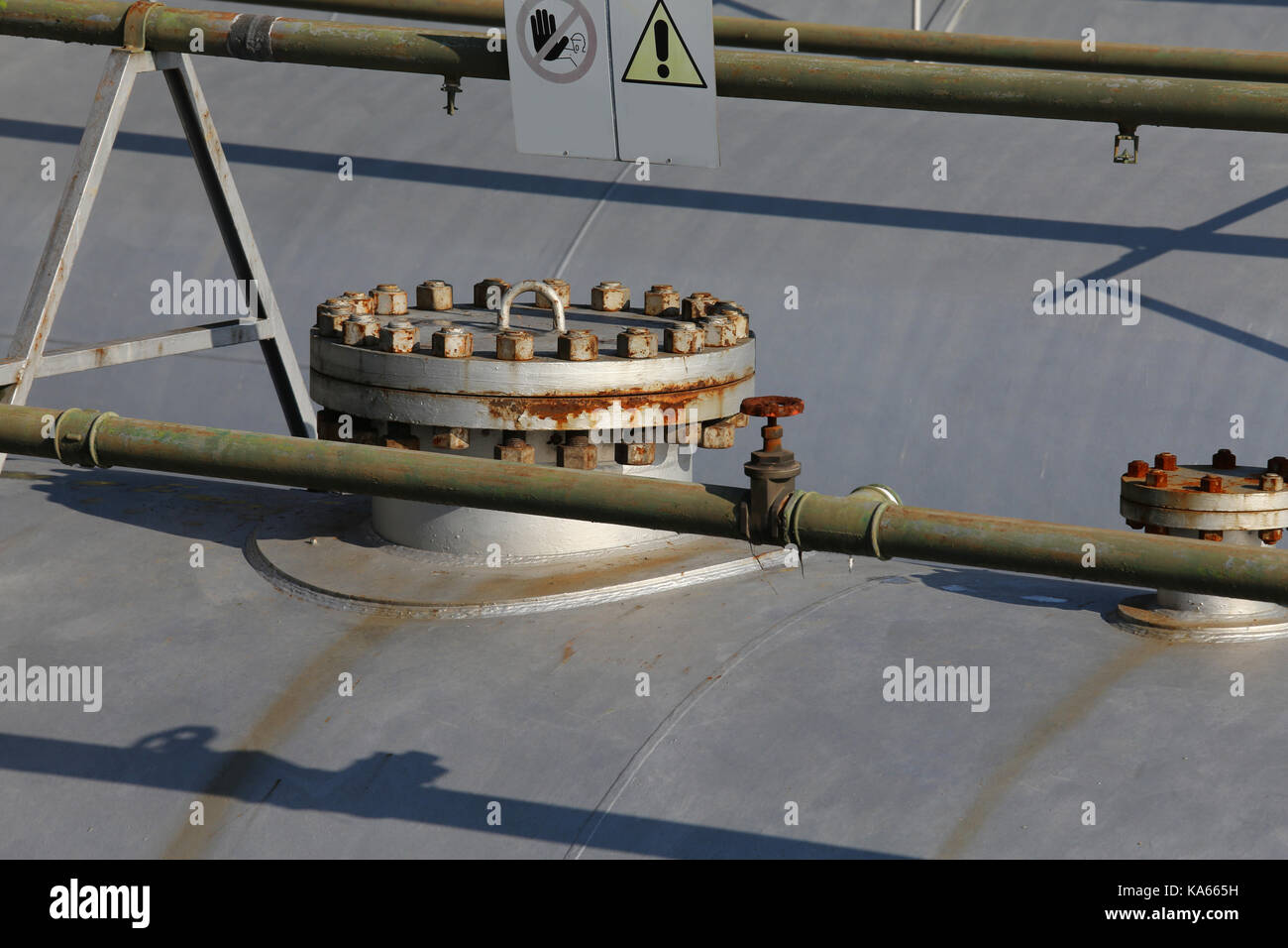 cover with bolts over big tank to contain methane gas in an industrial ...