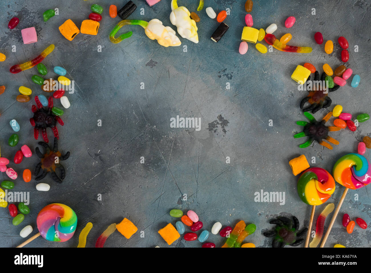 Colorful halloween candies on stone Stock Photo - Alamy