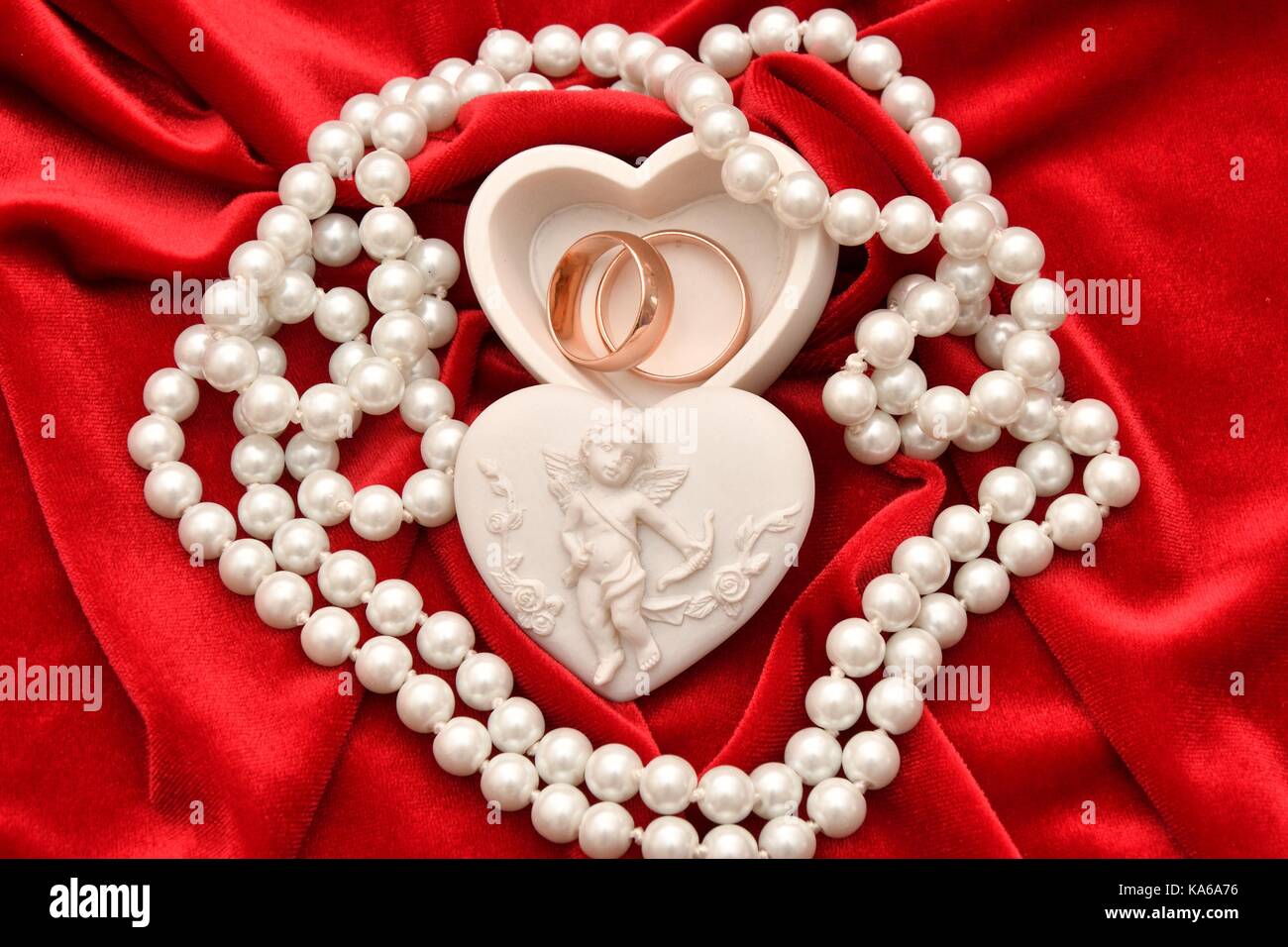 Two wedding rings for bride and groom Stock Photo - Alamy