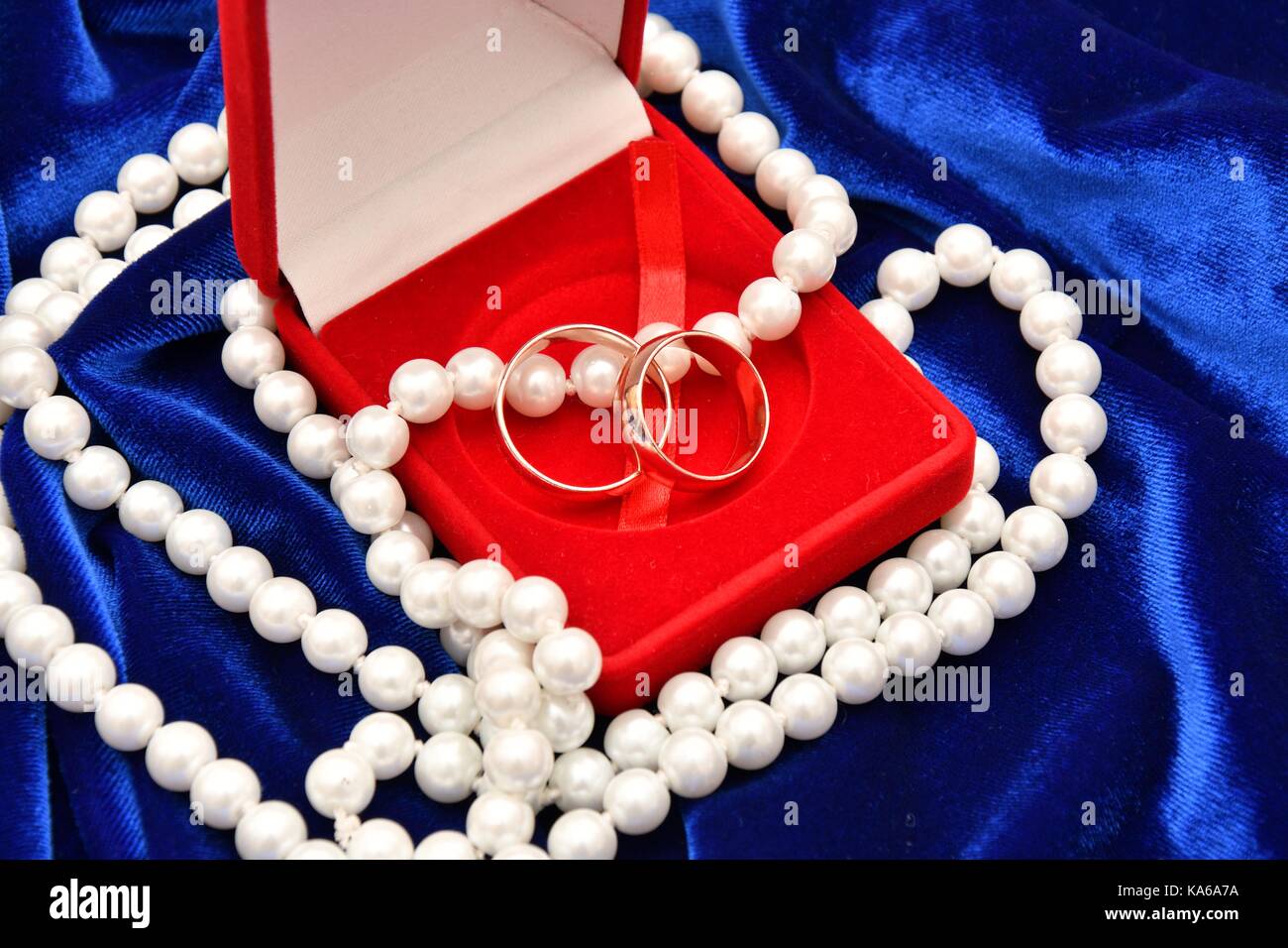 Two wedding rings for bride and groom Stock Photo - Alamy