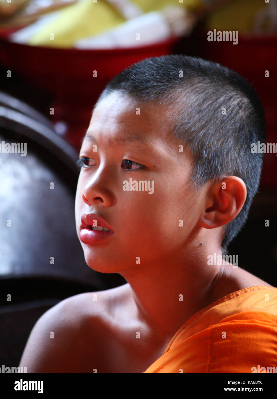 Daily life in a Buddhist monastery. Closeup portrait of young boy by ...