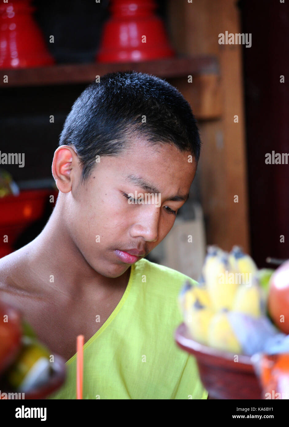 Daily life in a Buddhist monastery. Closeup portrait of young boy by ...
