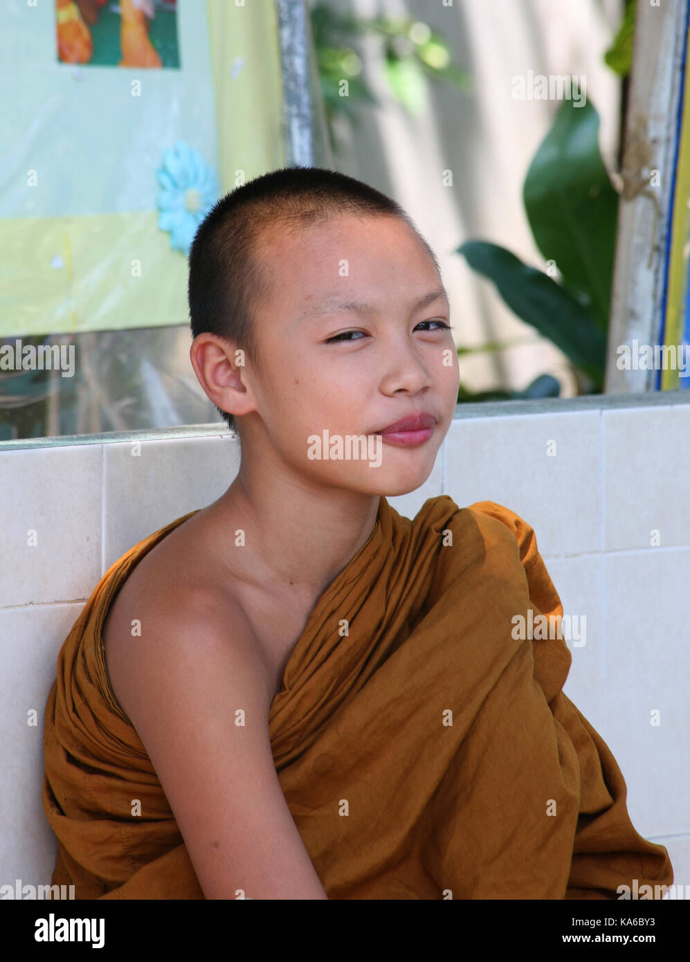 Daily life in a Buddhist monastery. Closeup portrait of a little ...