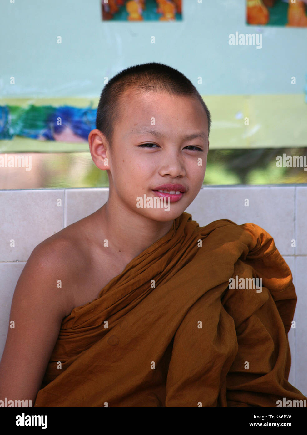 Daily life in a Buddhist monastery. Closeup portrait of a little ...