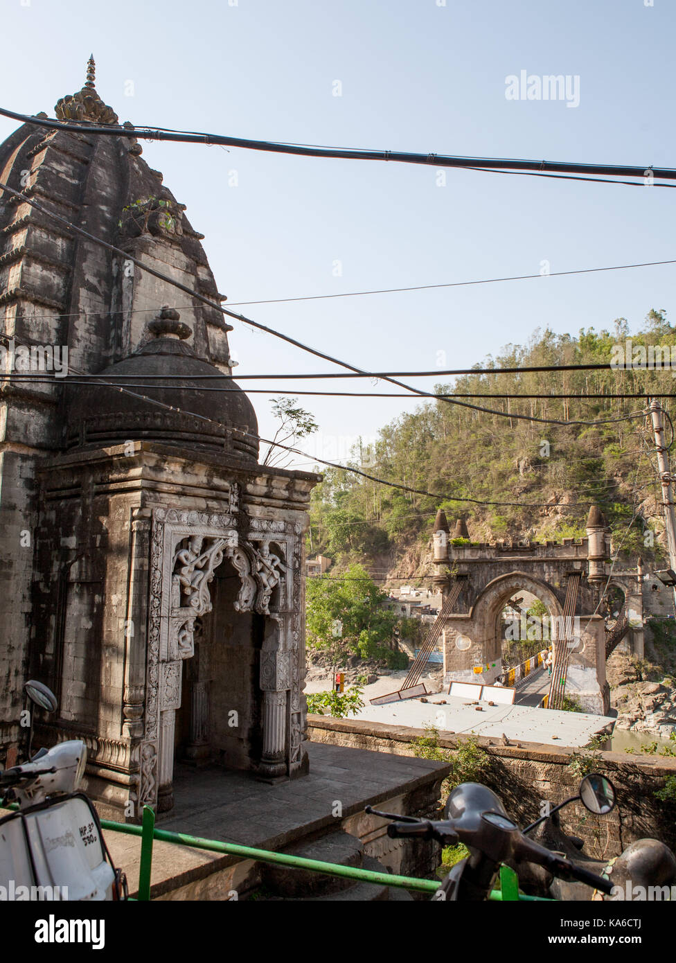 Ancient Hindu temple and the old suspension bridge Victoria in Northern ...
