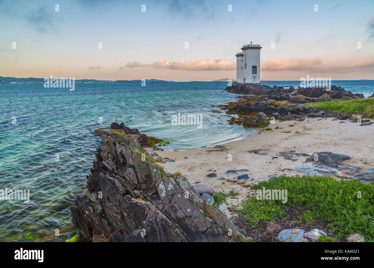Port Ellen Lighthouse, Carraig Fhada Lighthouse in evening light after ...