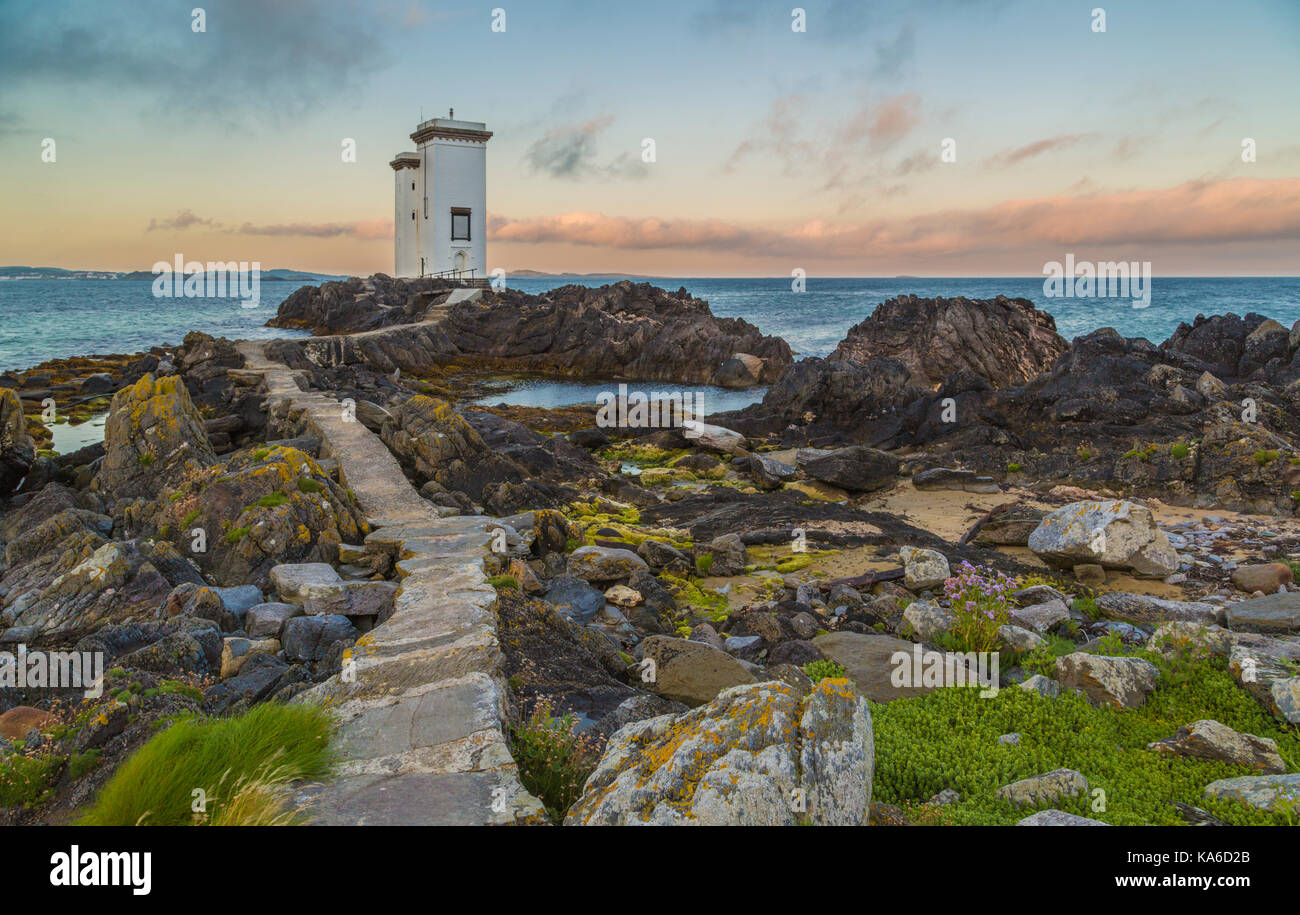 Port Ellen Lighthouse, Carraig Fhada Lighthouse in evening light after ...