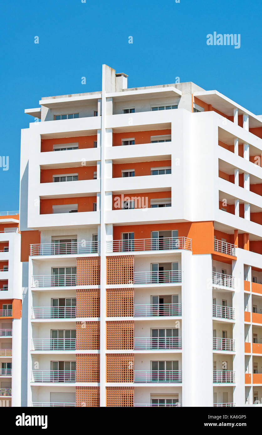 Orange apartment building in Portimao city, Portugal Stock Photo - Alamy