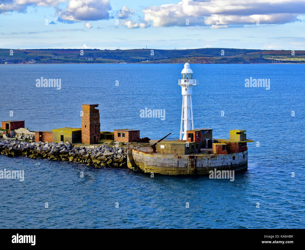 Portland Dorset harbour entrance lighthouse and sea wall Stock Photo ...