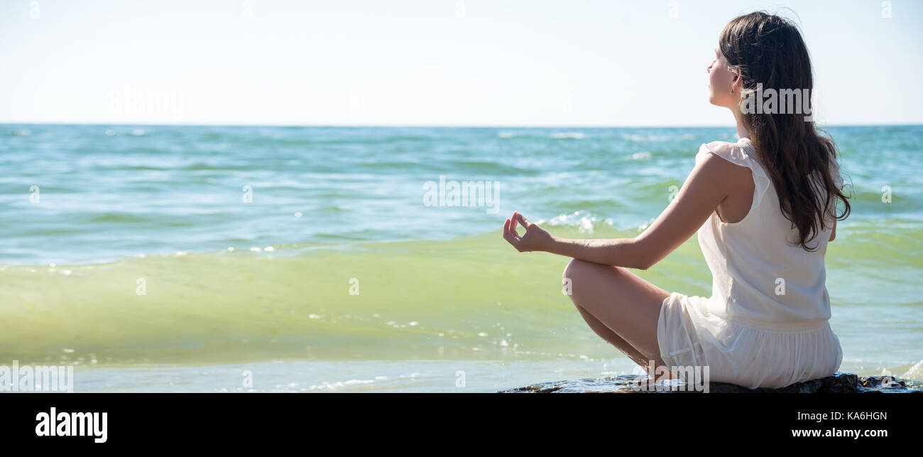 serenity and yoga practicing at the sea Stock Photo - Alamy