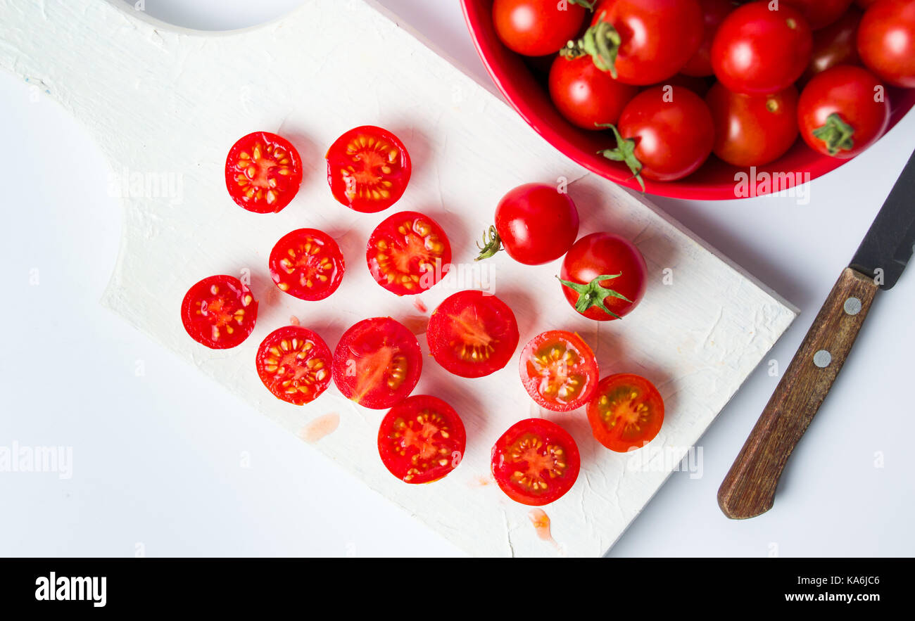 Cherry tomato on cutting hi-res stock photography and images - Alamy