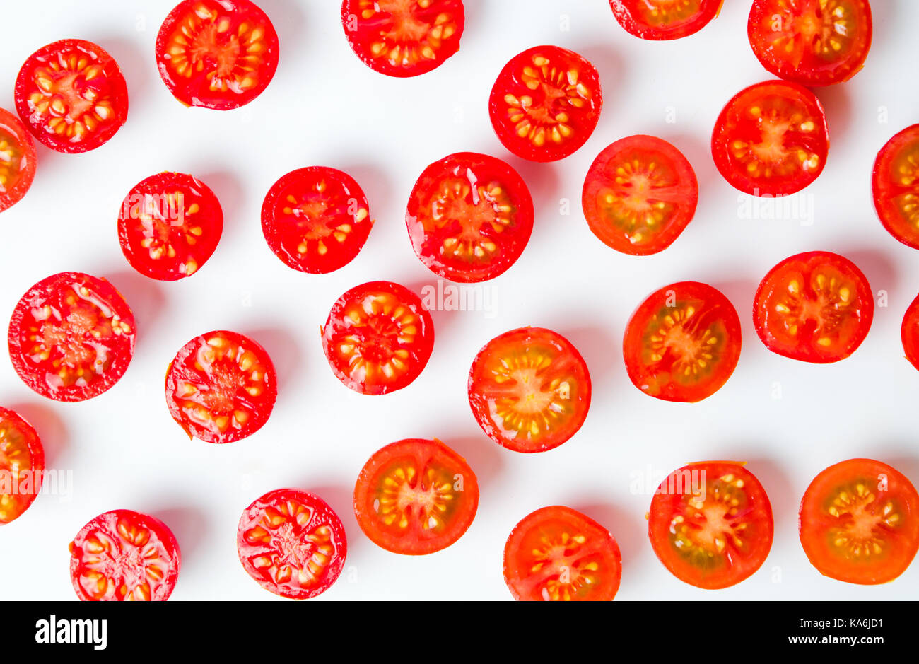 Sliced small cherry tomatoes background flat lay Stock Photo - Alamy