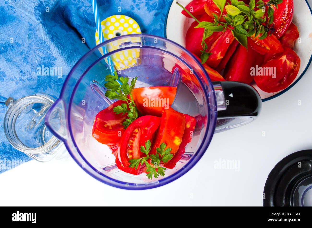 Tomato slices in a blender for a healthy smoothie Stock Photo - Alamy