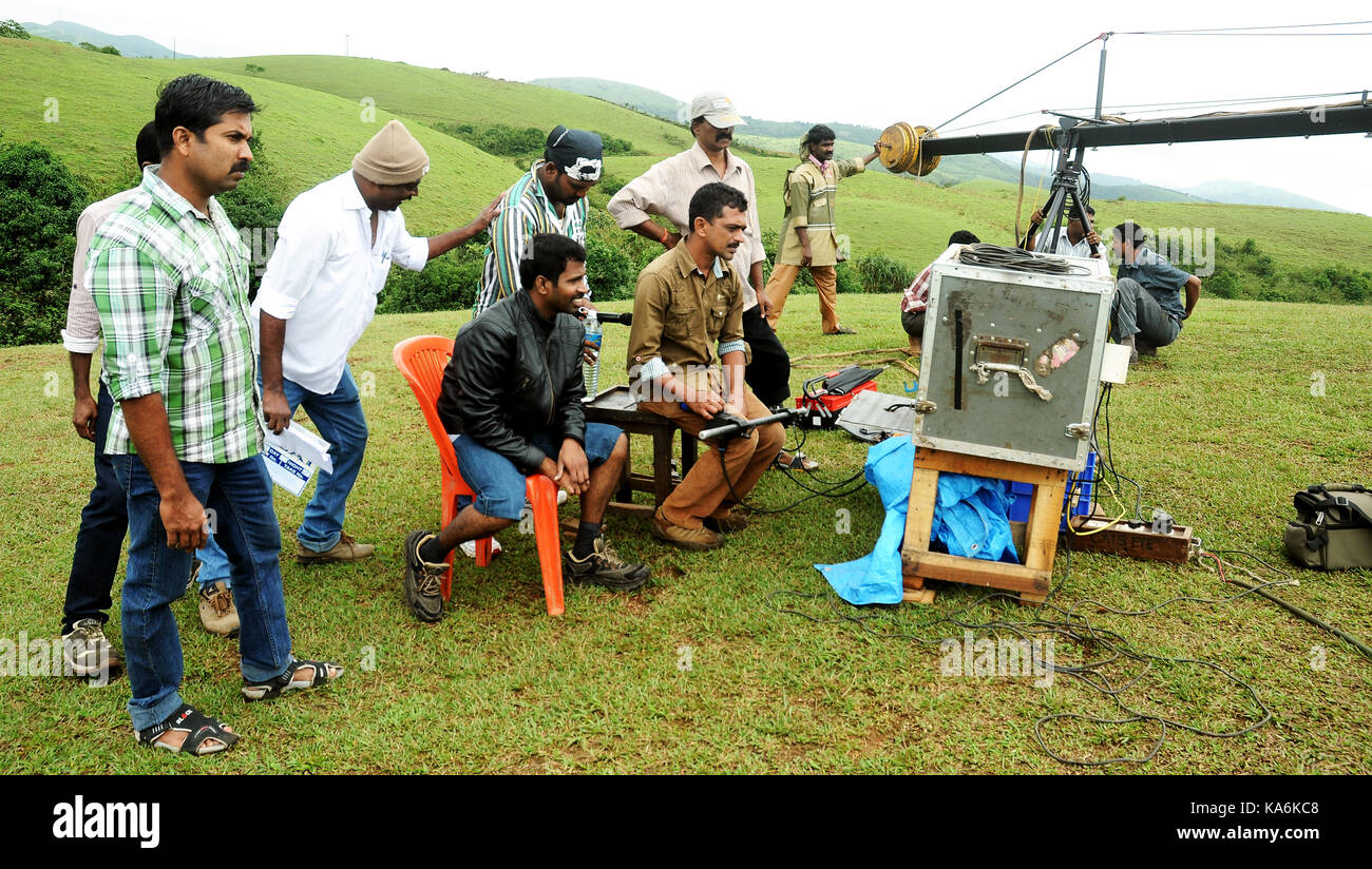 Film Crew On Location Morning Shoot watching a performance reply at ...