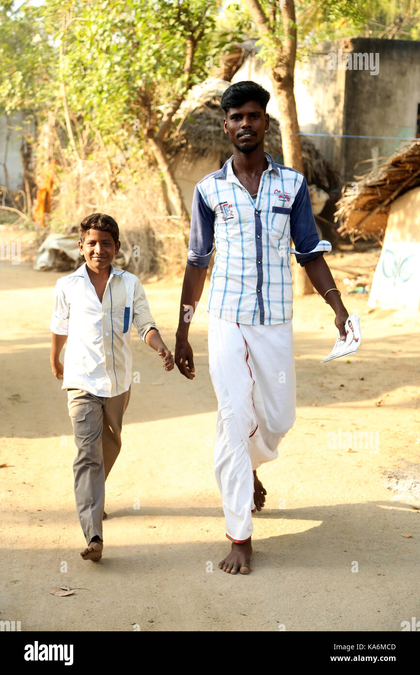 Portrait of unidentified Indian boys walking on the street Stock Photo ...