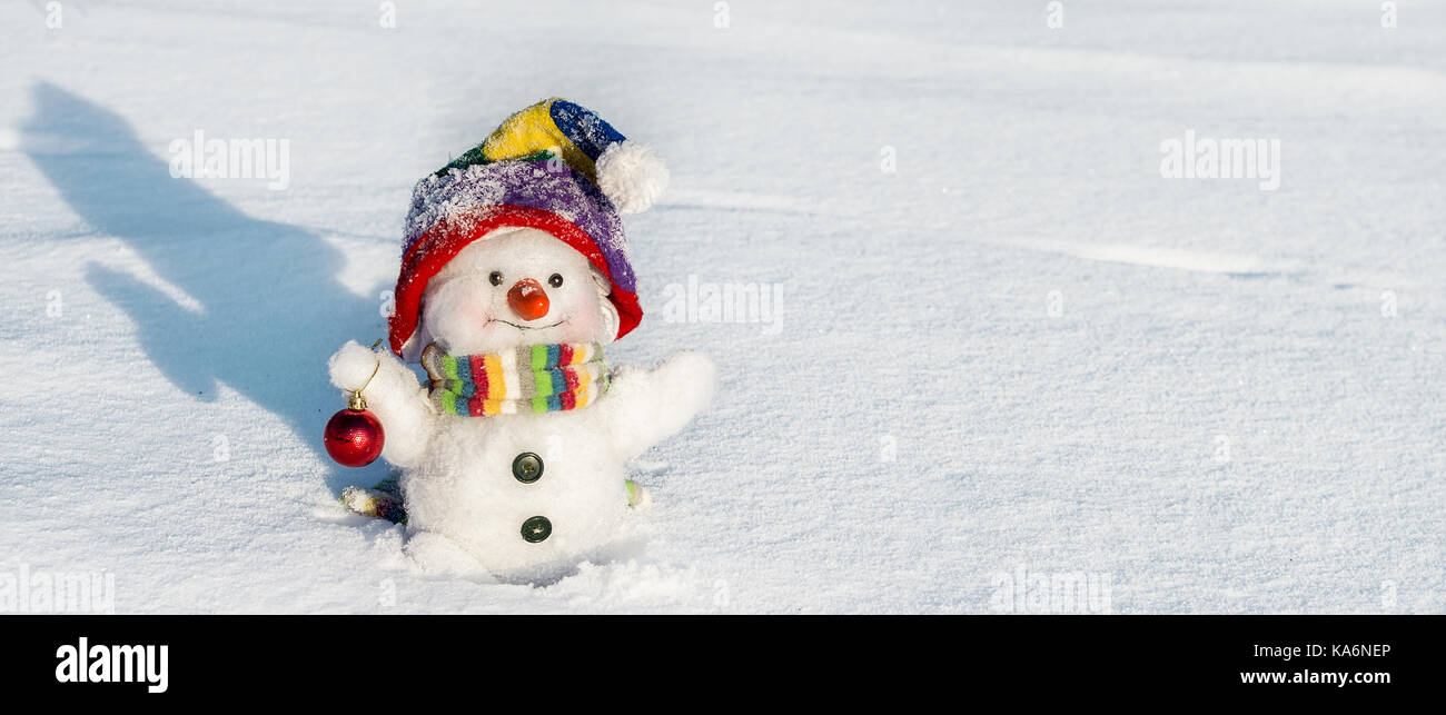 Happy snowman with hat in the snow Stock Photo - Alamy