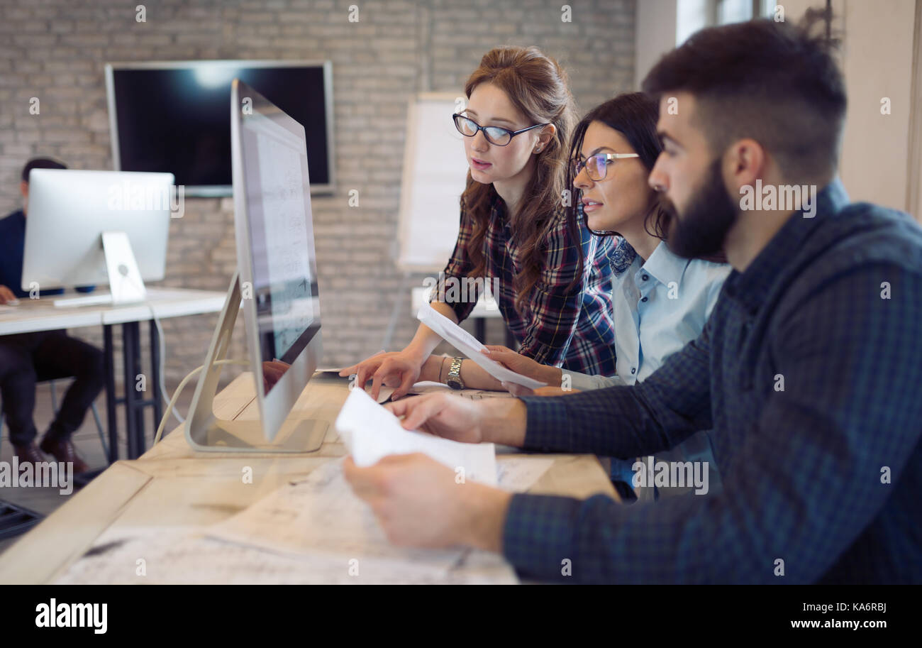 Company employees working in office Stock Photo - Alamy