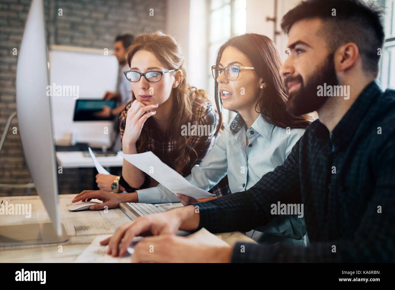 Company employees working in office Stock Photo - Alamy