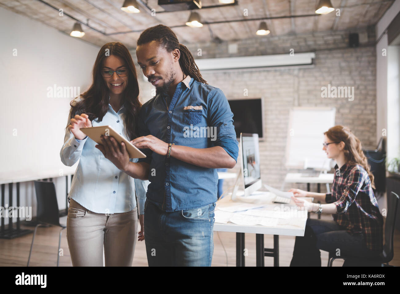 Company coworkers working in office Stock Photo - Alamy